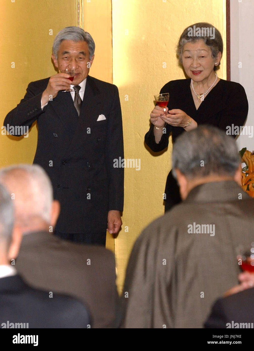 NAZE, Japan - Emperor Akihito and Empress Michiko propose toasts during ...