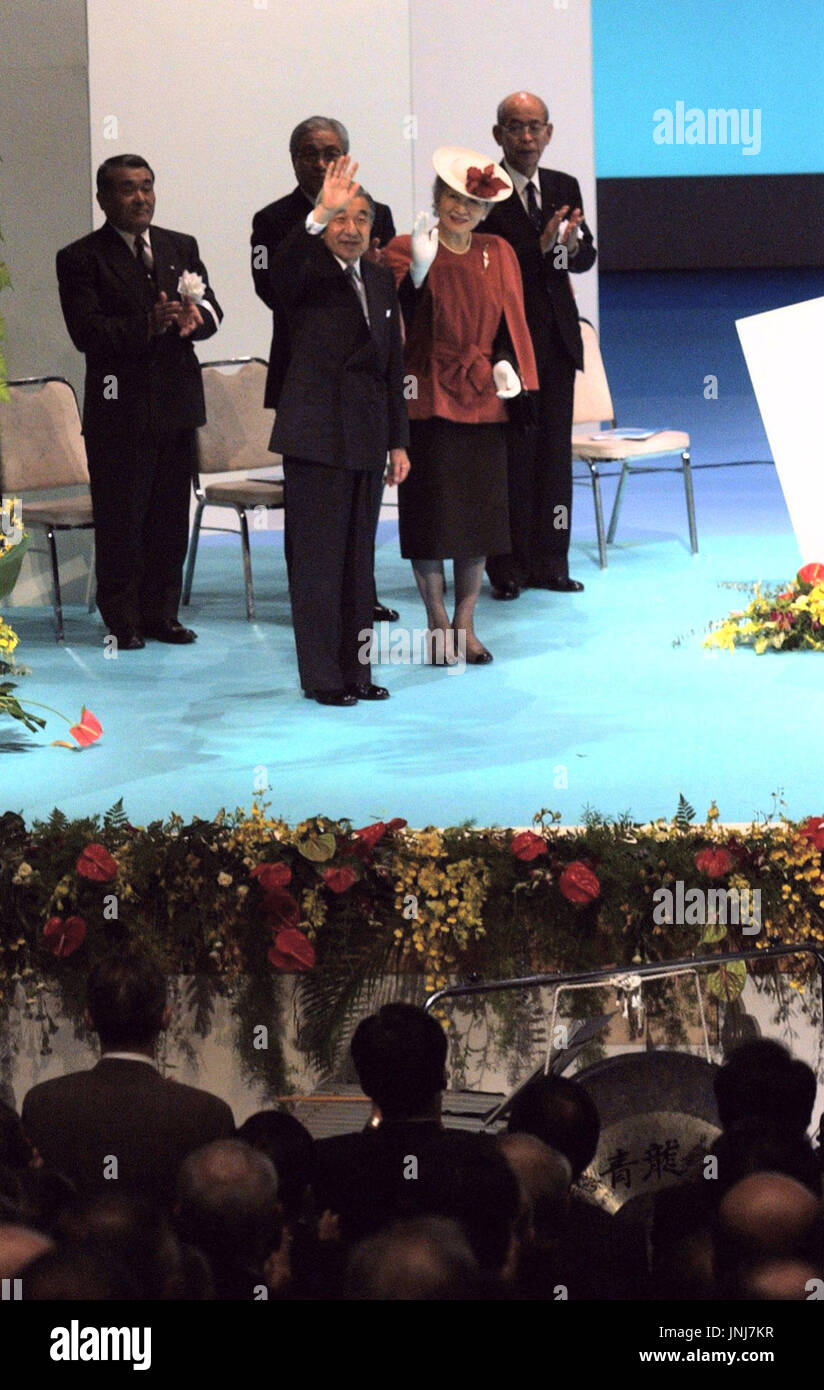 NAZE, Japan - Emperor Akihito and Empress Michiko wave at the audiences ...