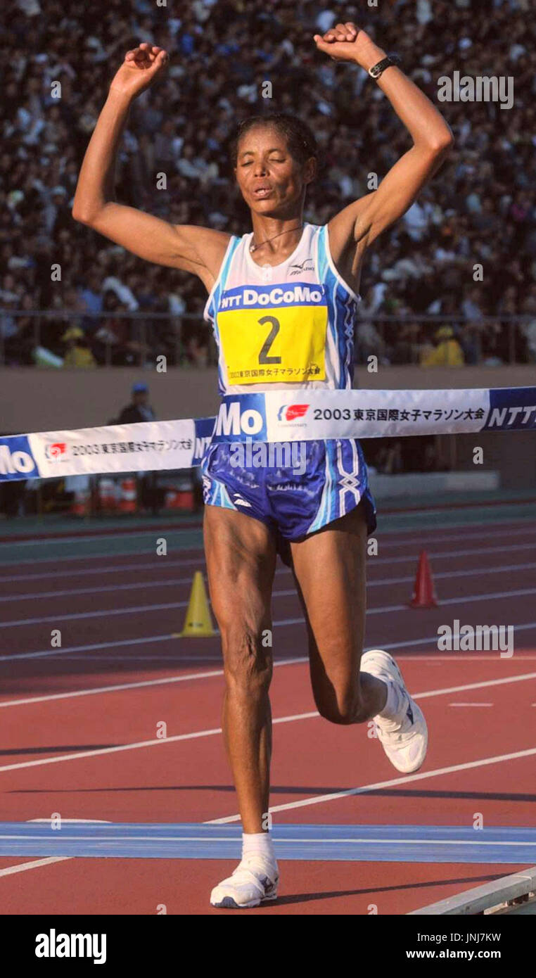 TOKYO, Japan - Ethiopian Elfenesh Alemu crosses the finish line at the ...