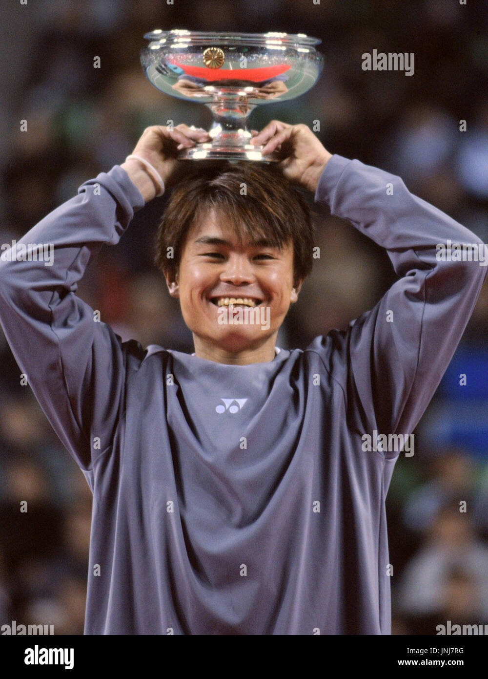 TOKYO, Japan - Top seed Goichi Motomura raises a trophy after winning ...