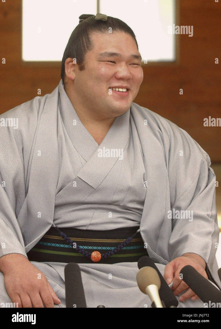 FUKUOKA, Japan - Ozeki Tochiazuma smiles during a press conference in ...