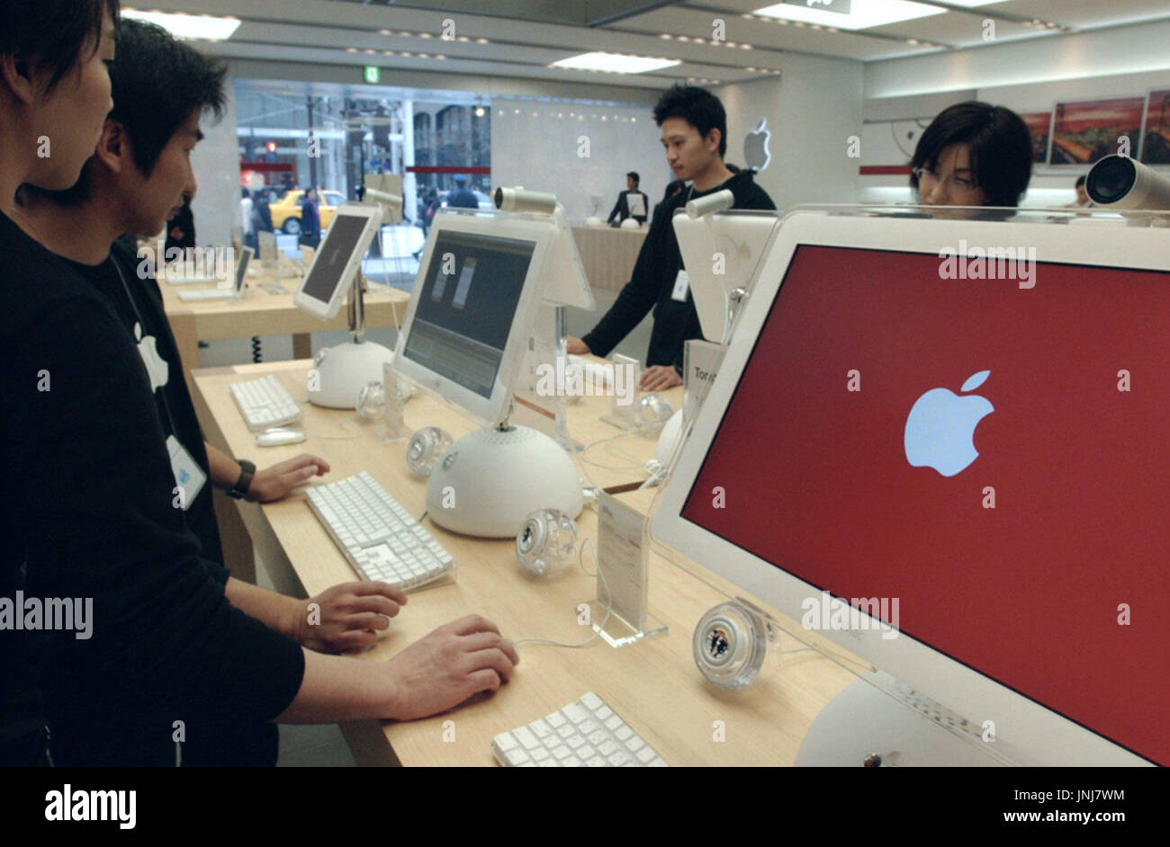 TOKYO, Japan - Visitors test out products at the first retail store set ...