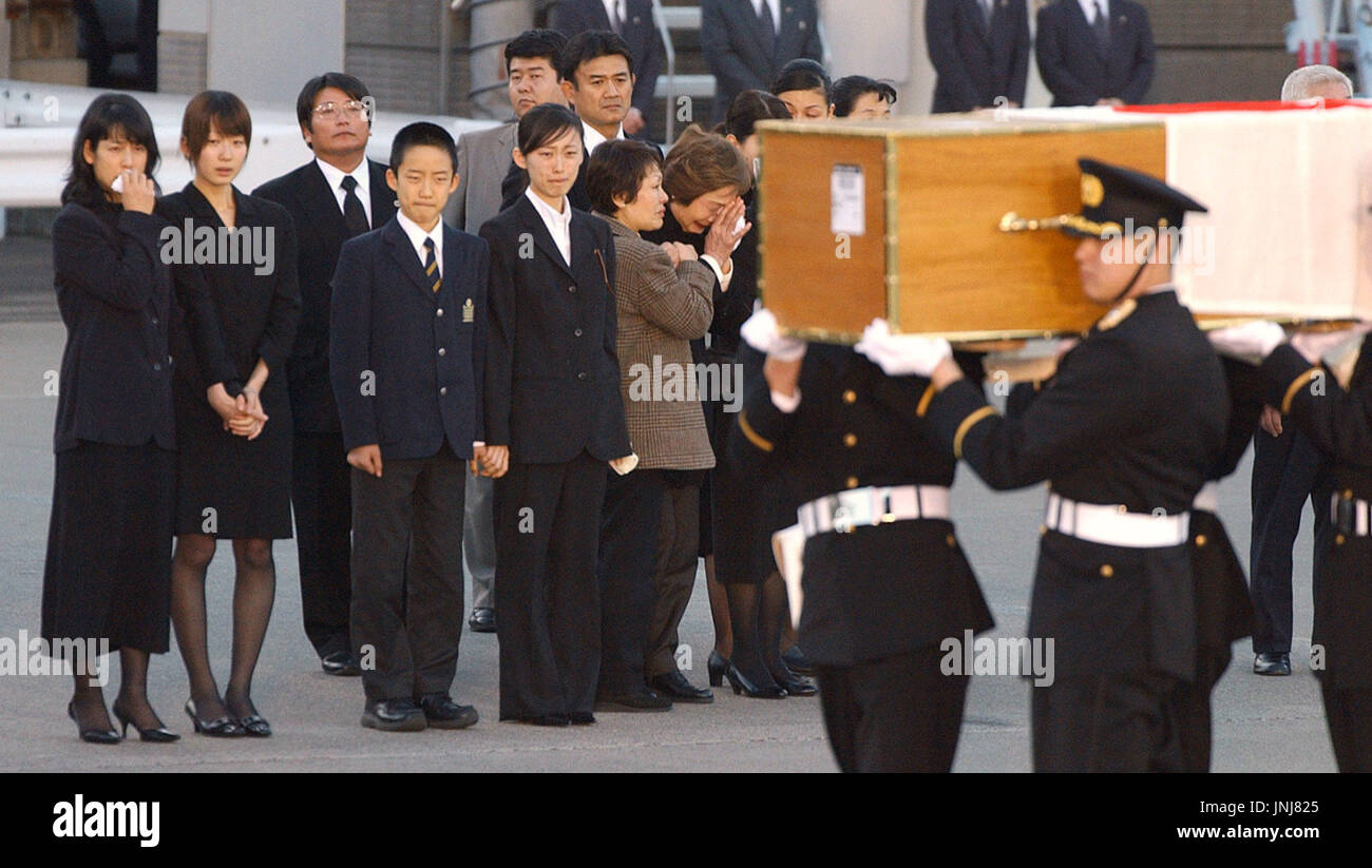 NARITA, Japan - The coffin containing the body of Katsuhiko Oku, a ...