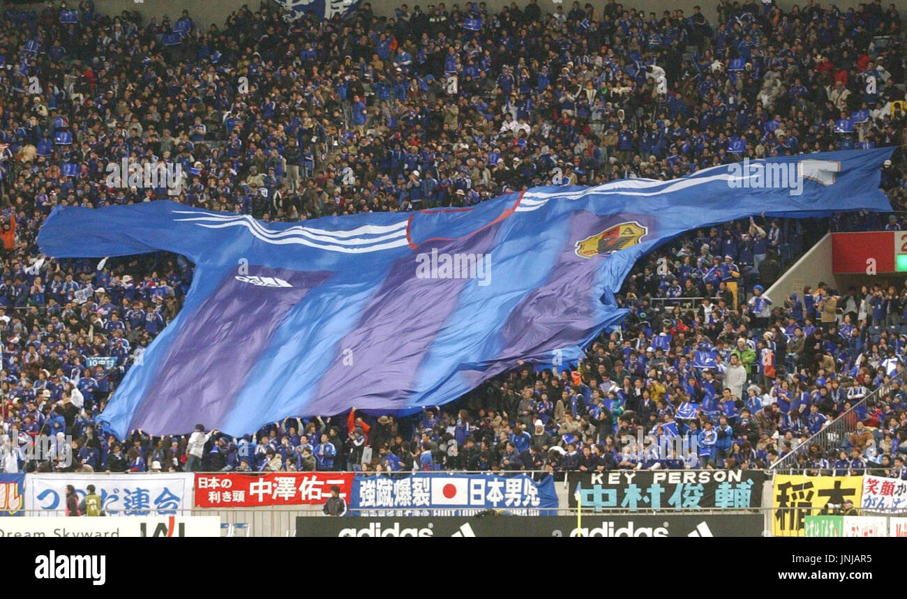 SAITAMA, Japan - Japanese soccer fans hold a huge uniform of Japan's ...