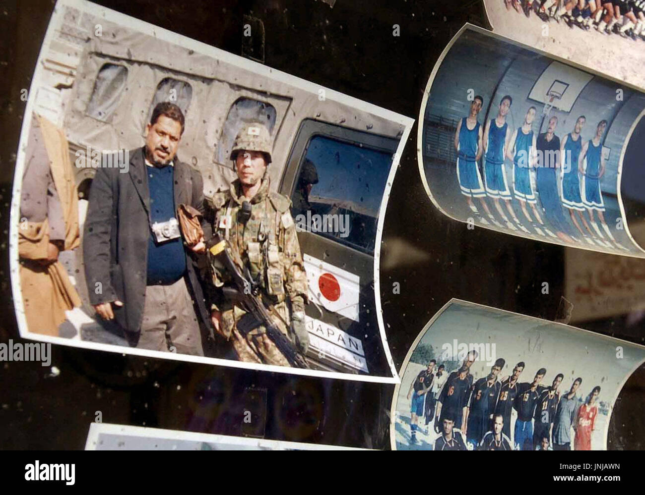 SAMAWAH, Iraq - A photo of an Iraqi citizen posing with a member of ...