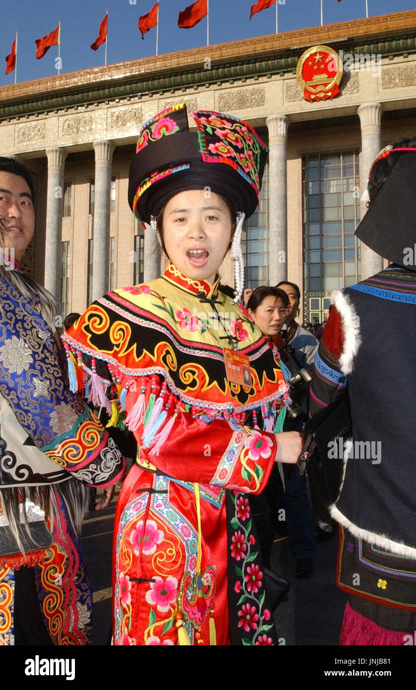 BEIJING, China -Representative wearing ethnic dress arrive at the Great ...