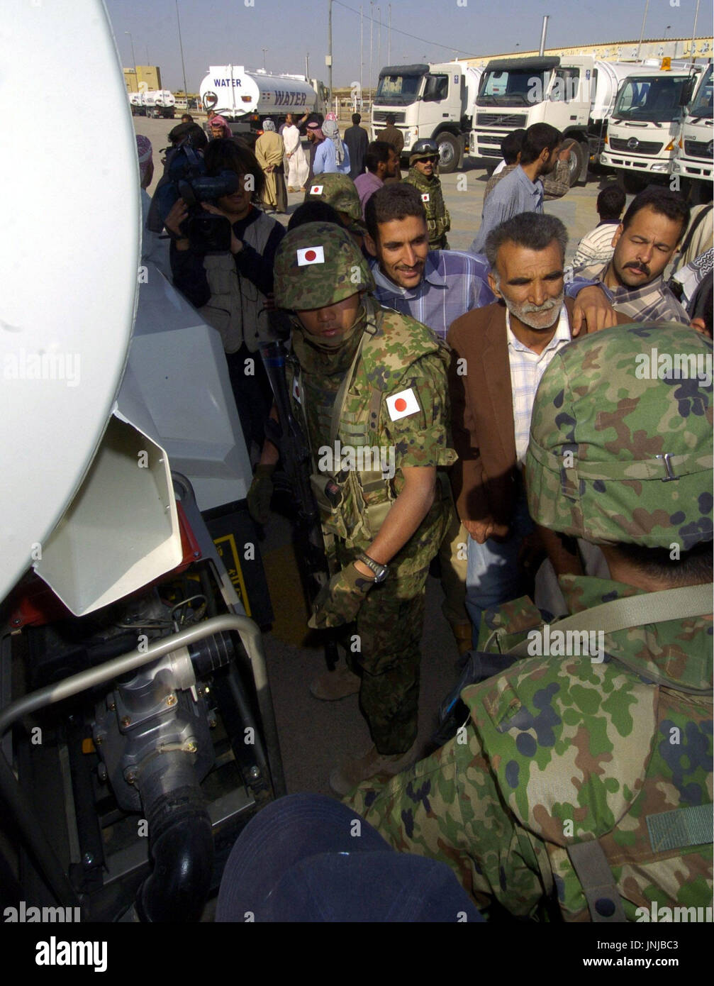 SAMAWAH, Iraq - Japan's Ground Self-Defense Force members give a ...