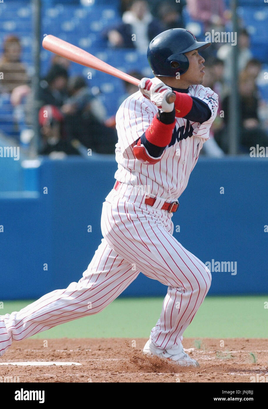 TOKYO, Japan - Yakult Swallows infielder Akinori Iwamura slams a solo ...