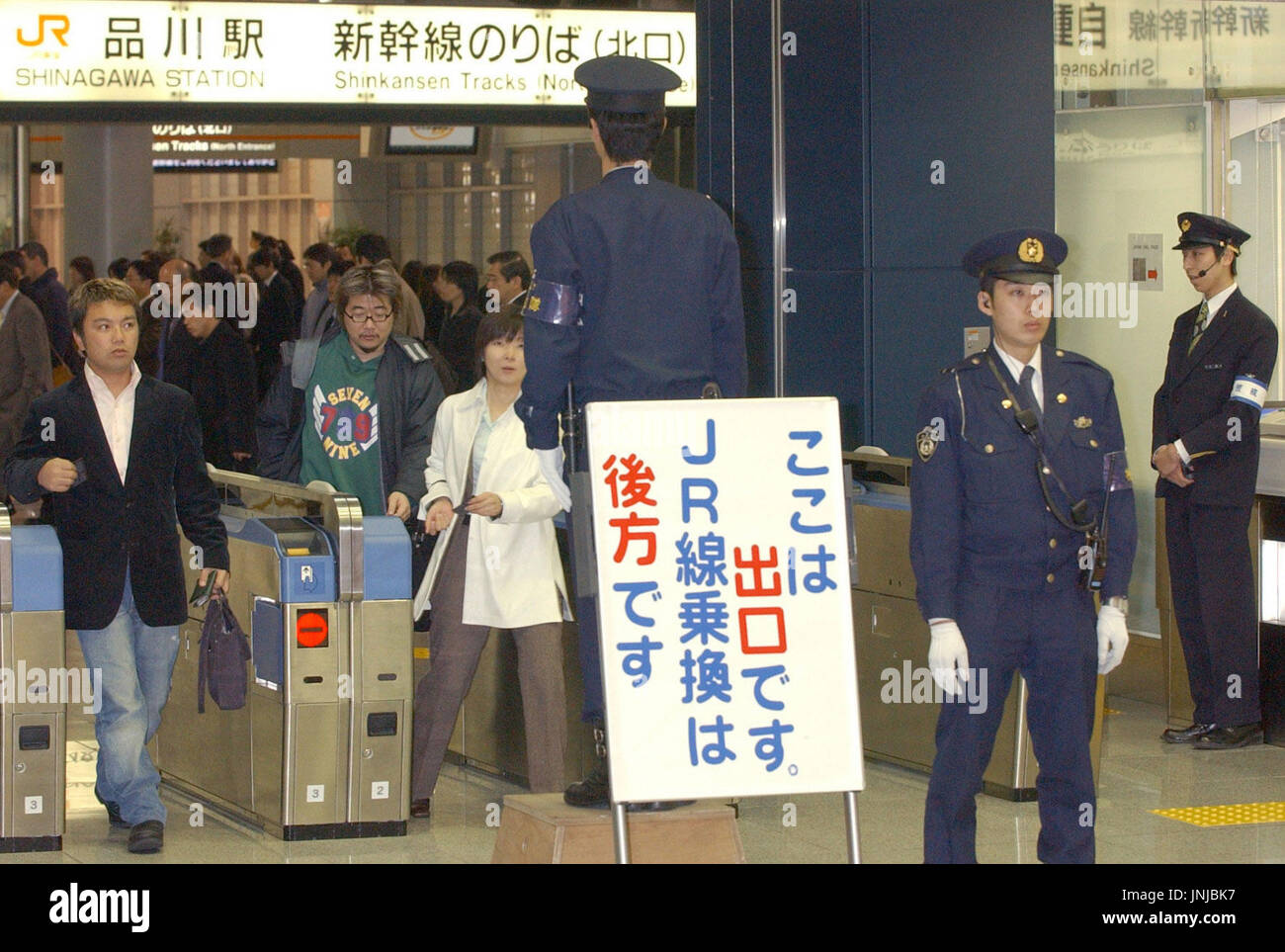 TOKYO, Japan - Police stand guard at Japan Railway's Shinagawa Station ...