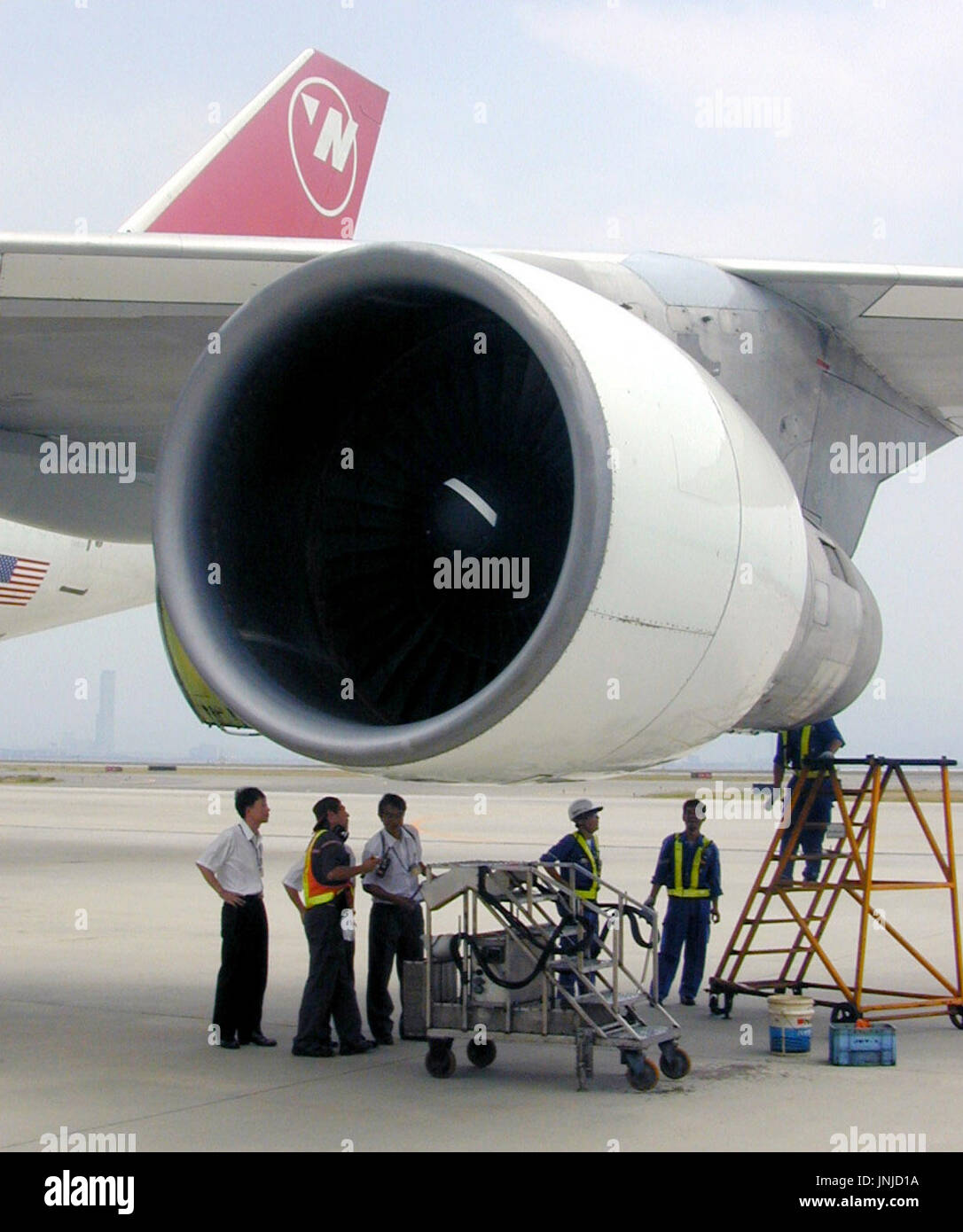 OSAKA, Japan - Northwest Airlines officials check a Boeing 747 cargo ...