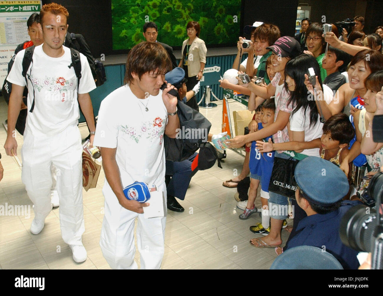 NARITA, Japan - Japan's Under-23 striker Yoshito Okubo (R) and defender Marcus Tulio Tanaka (L ...