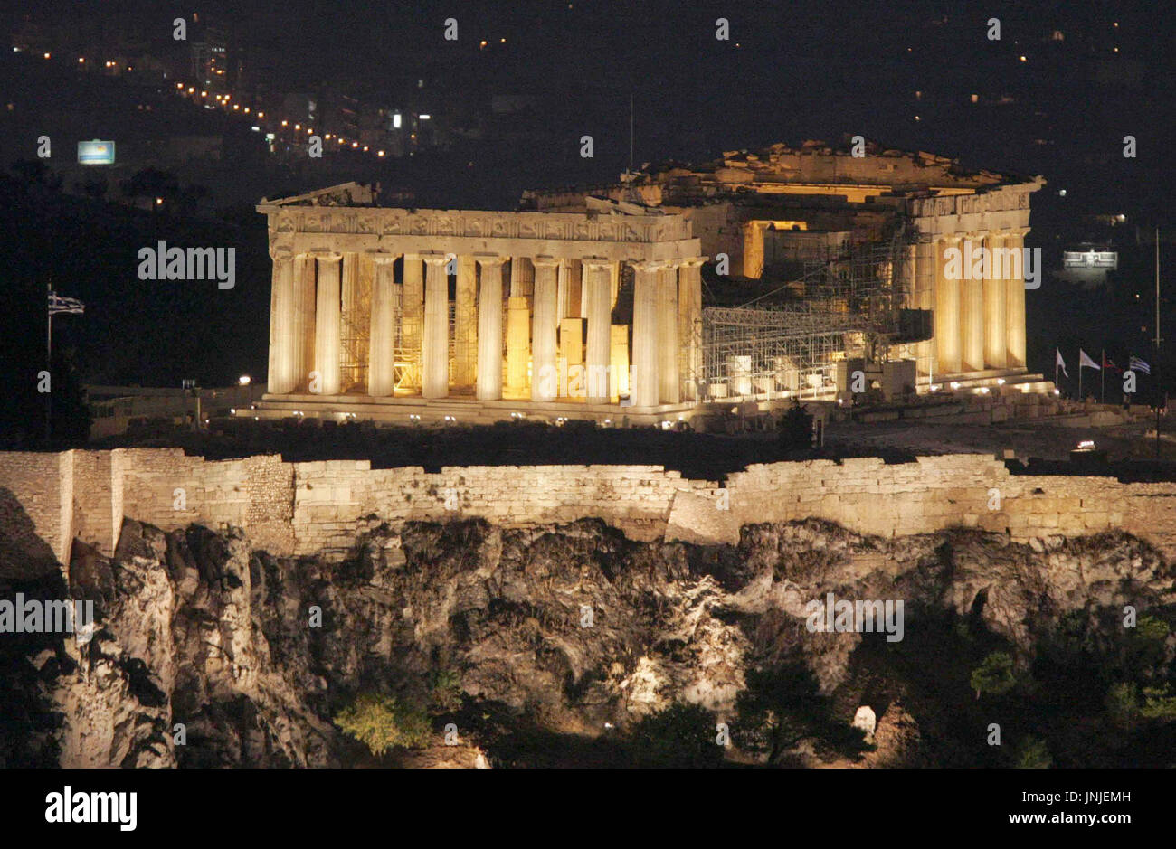 ATHENS, Greece - The Olympic torch burns overnight at the Parthenon on ...