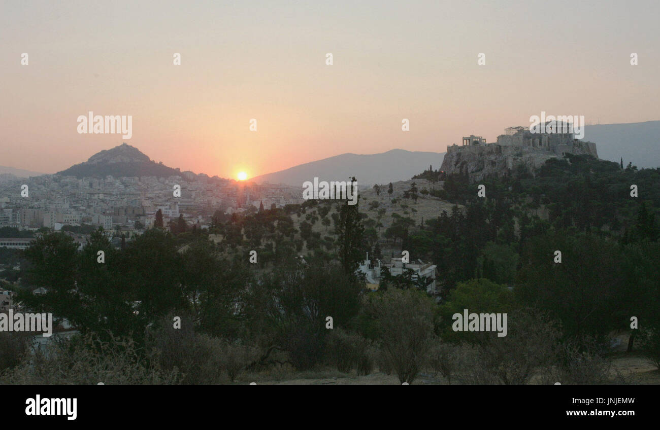 ATHENS, Greece - The sun rises in Athens on Aug. 13 as Greece braces up ...