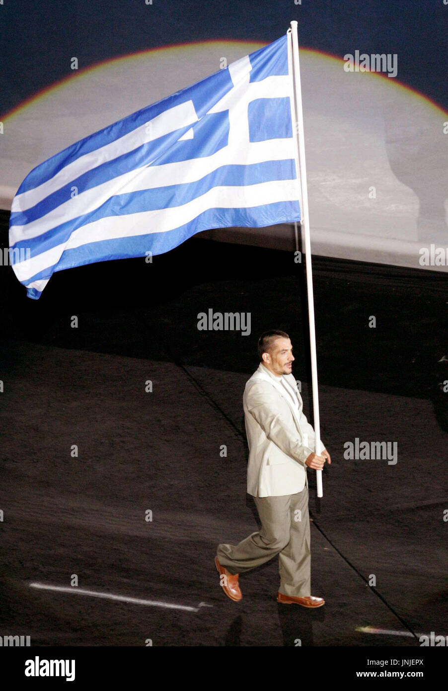 ATHENS, Greece - Weight-lifter Pyrros Dimas carries the Greek flag ...