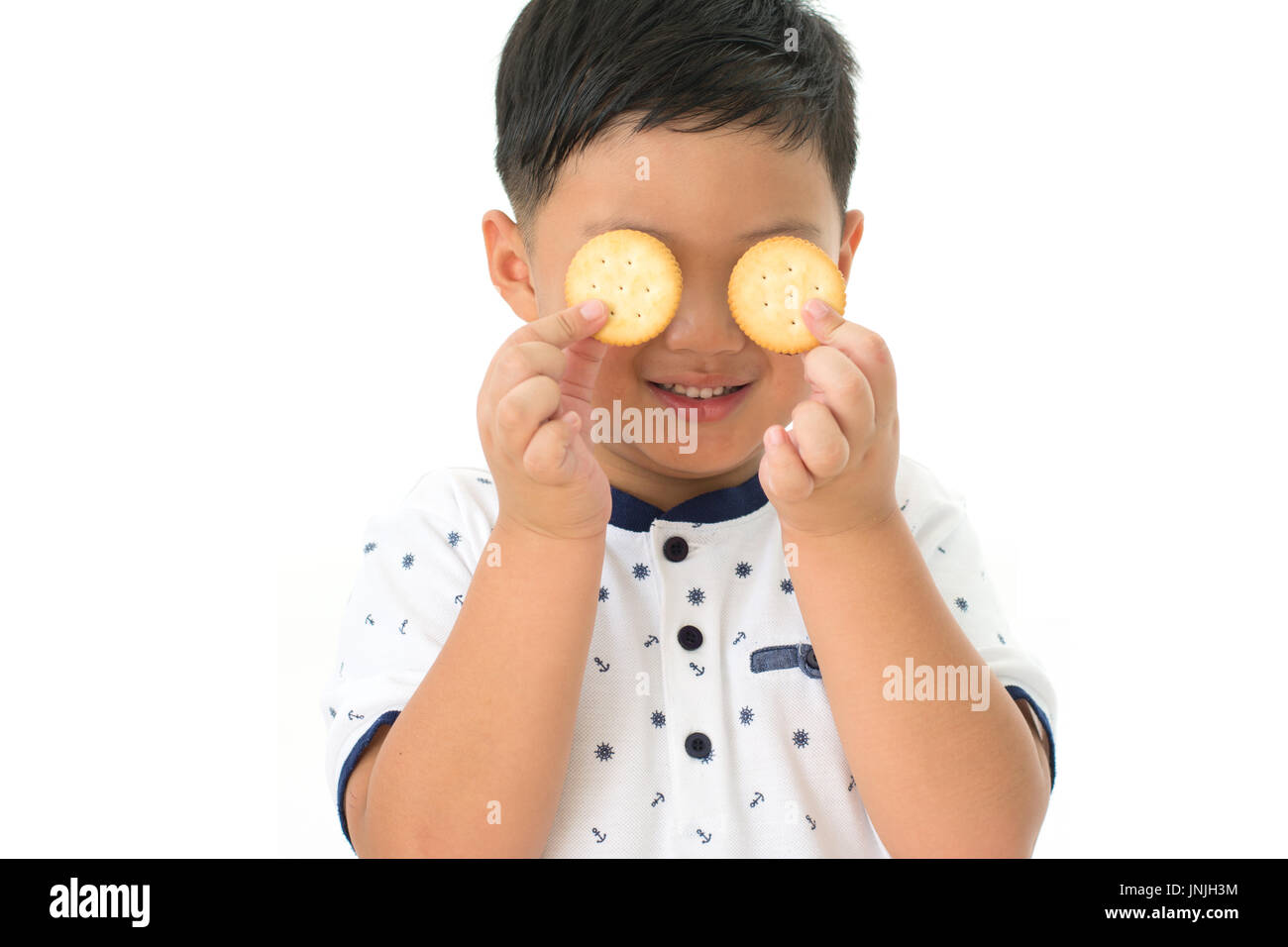 Little boy shutting eye with cookie isolated on white background Stock ...