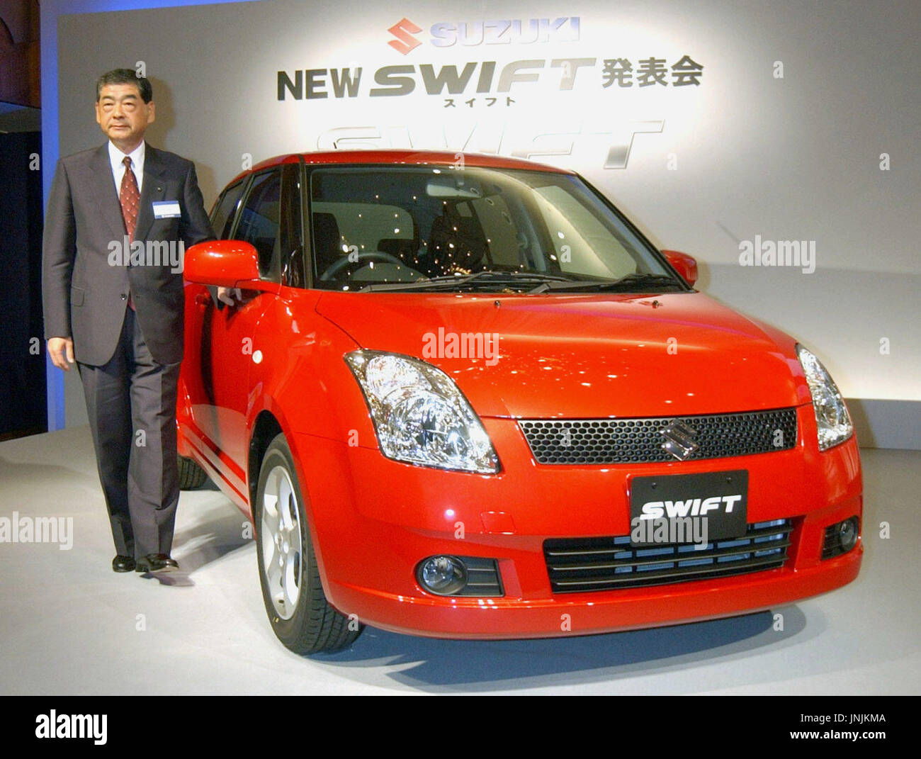 TOKYO, Japan - Suzuki Motor Corp. President Hiroshi Tsuda unveils a new ...
