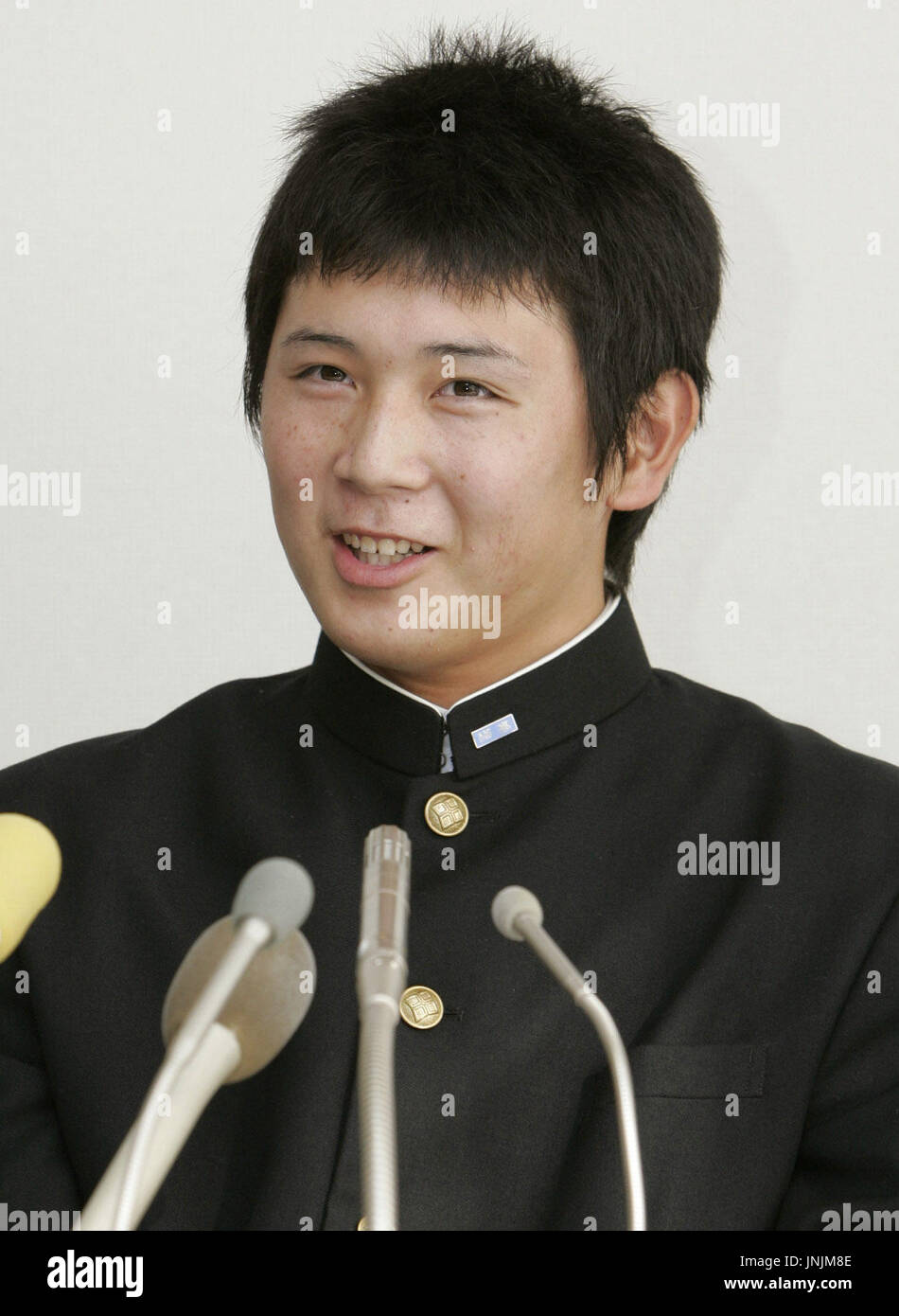 YOKOHAMA, Japan - Yokohama high school pitcher Hideaki Wakui smiles at ...