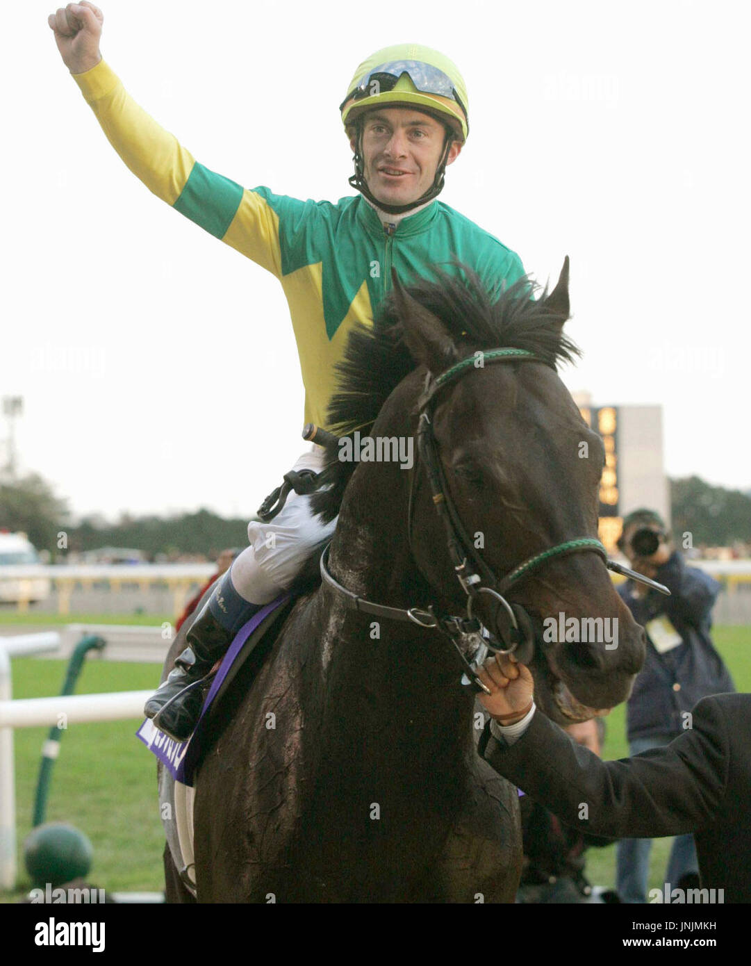 TOKYO, Japan - French jockey Olivier Peslier celebrates after seeing ...