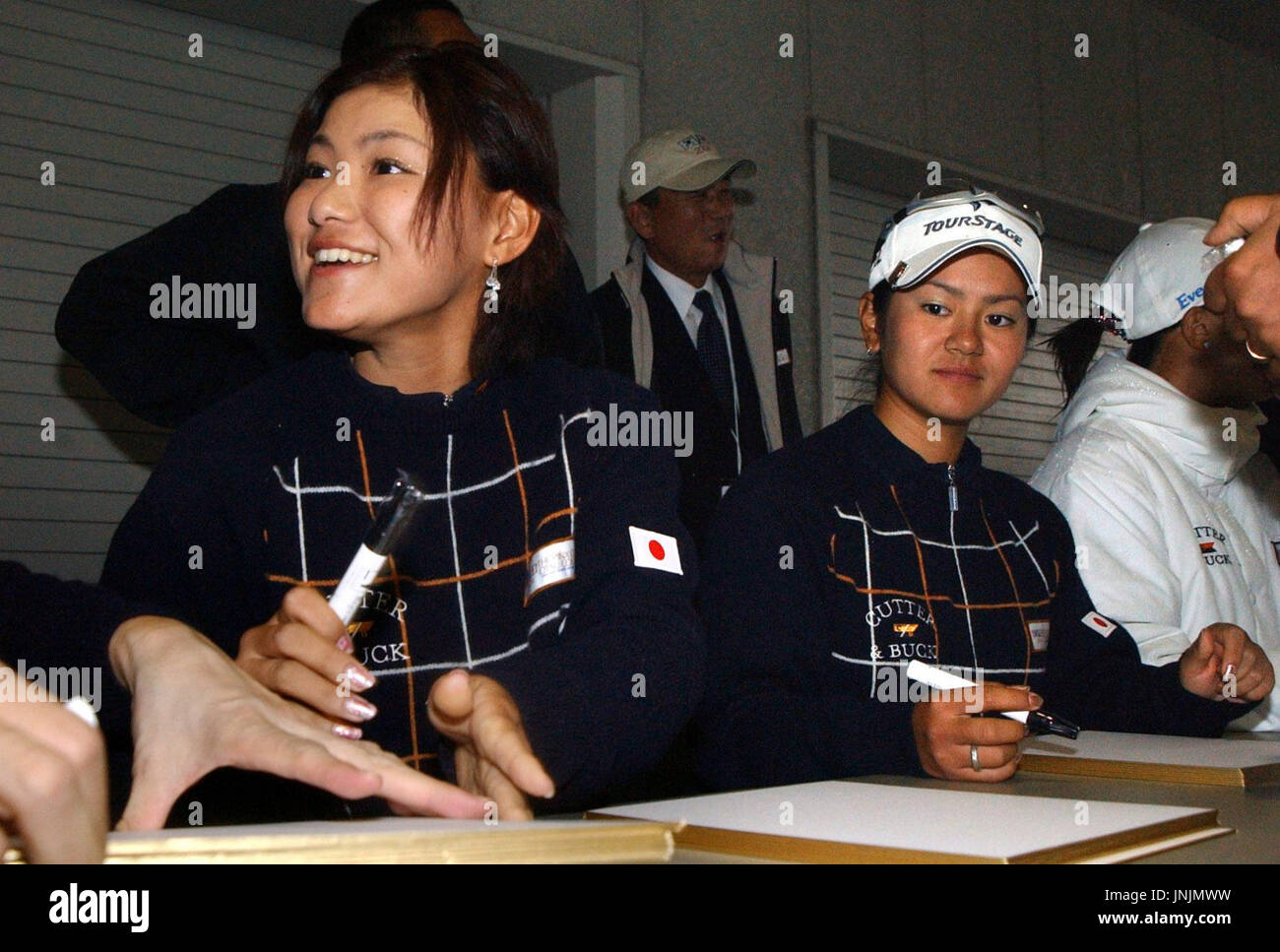 OTSU, Japan - Japan's Sakura Yokomine (L) and Ai Miyazato give their autographs after the ...