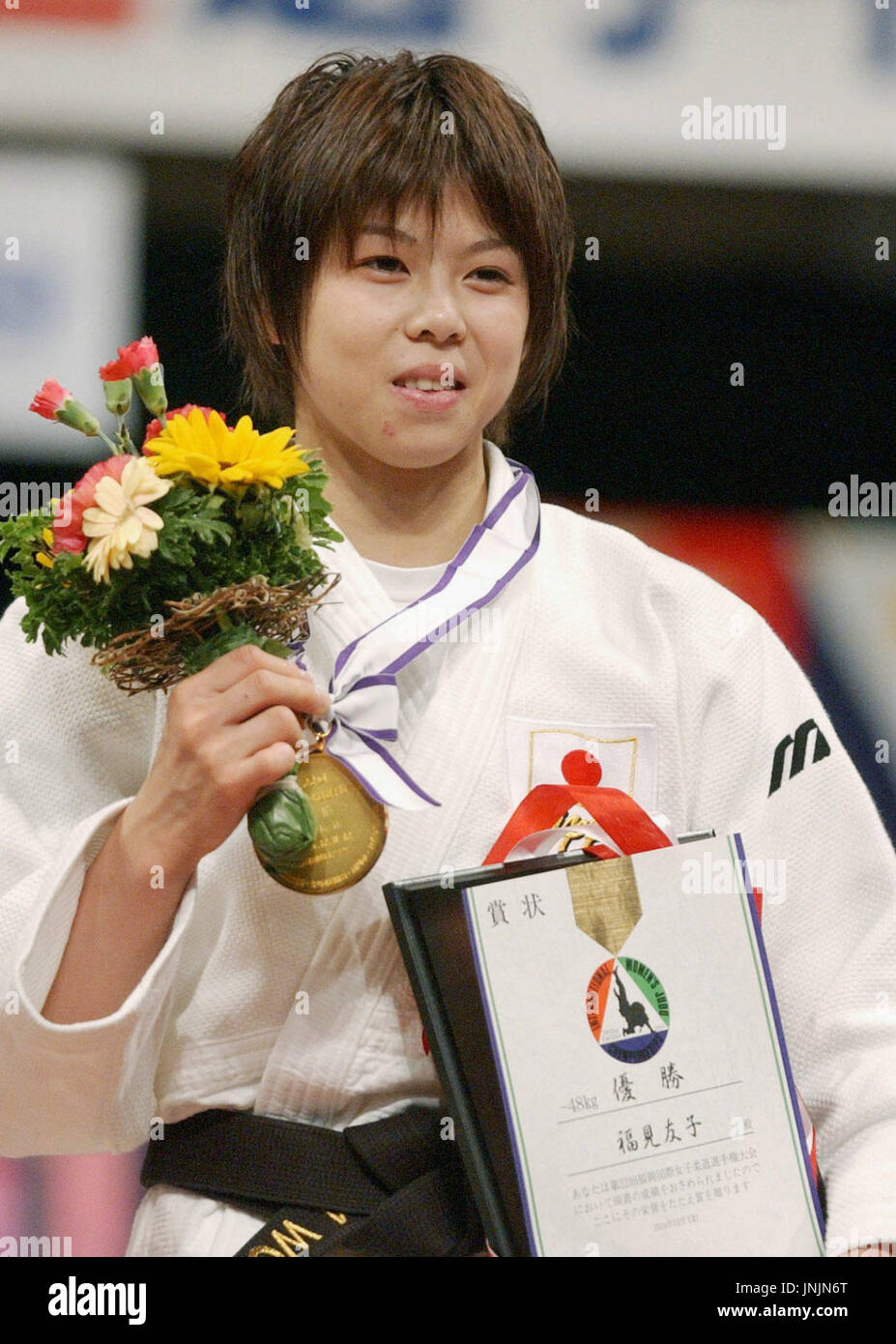 FUKUOKA, Japan - World junior champion Tomoko Fukumi wins a close ...