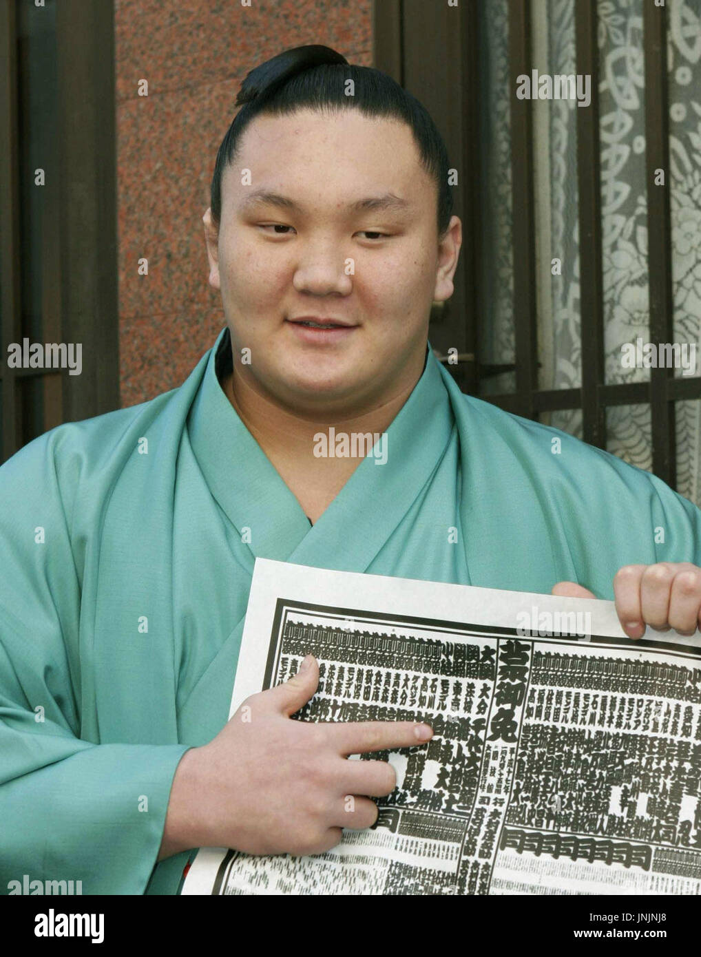 TOKYO, Japan - The 19-year-old rising star Hakuho of Mongolia points to ...