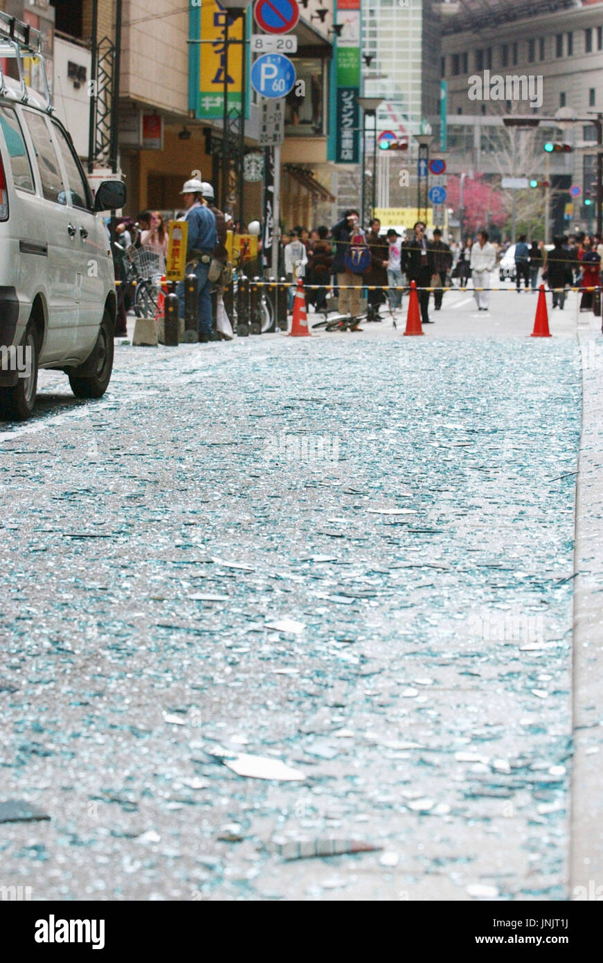 FUKUOKA, Japan - Broken glass is strewn along a road in Fukuoka after a ...