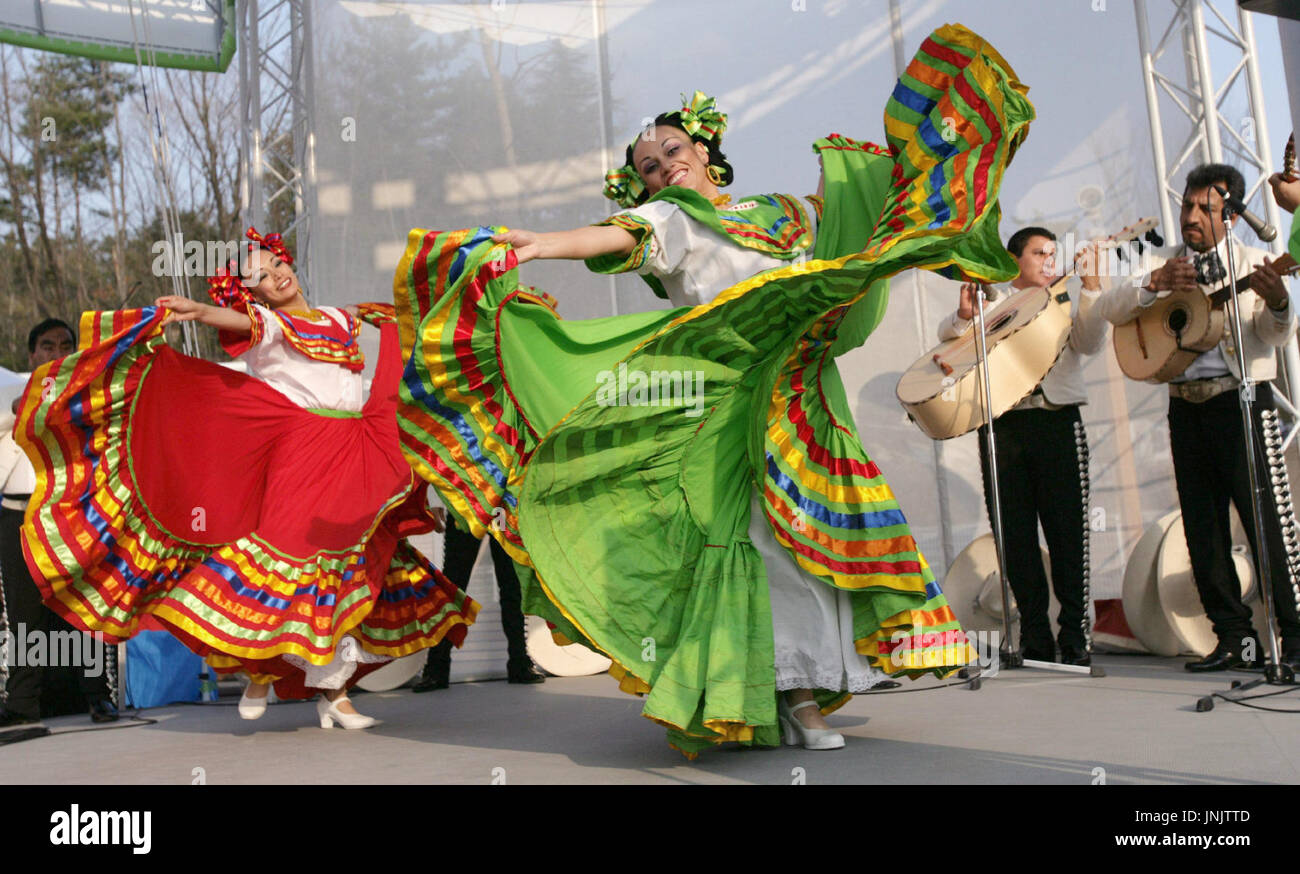 NAGAKUTE, Japan - Women dance in front of the Mexican pavilion at the ...