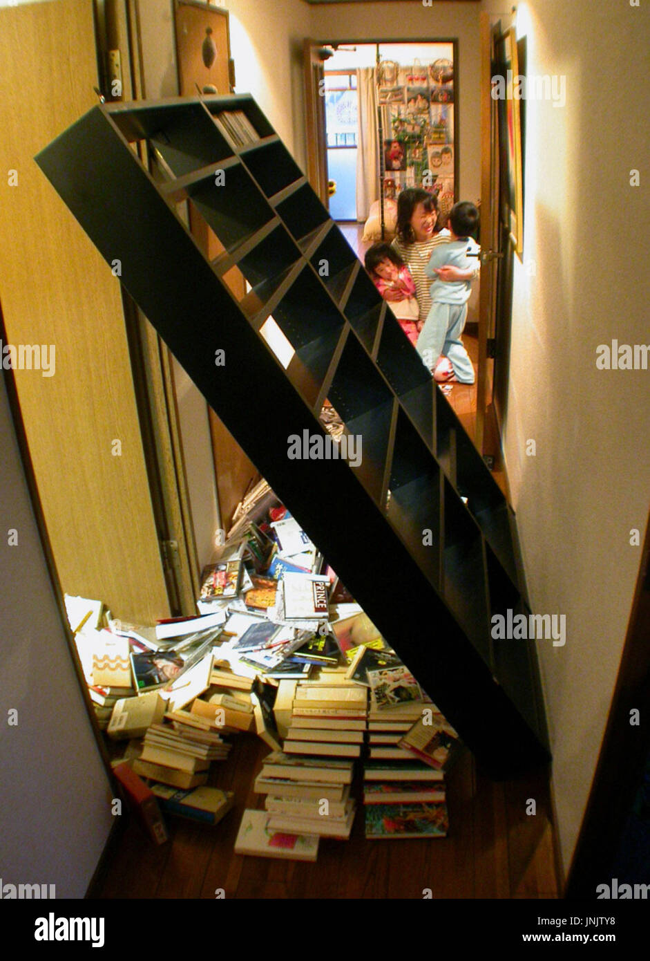 FUKUOKA, Japan - A bookshelf falls in a house in Fukuoka on April 20 ...