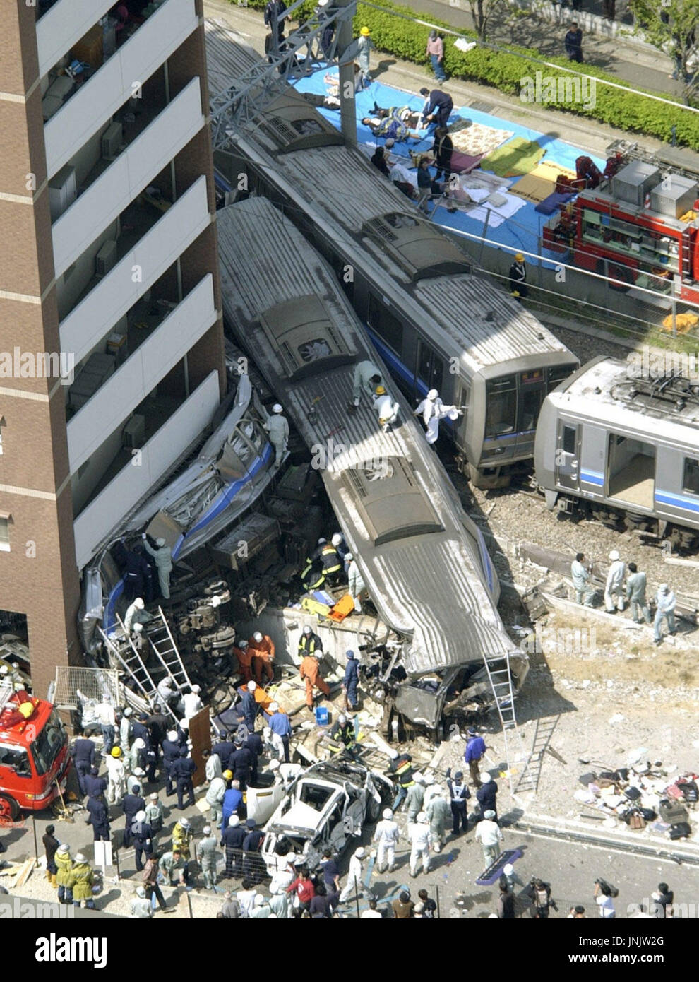 AMAGASAKI, Japan - An aerial photo shows train cars that derailed ...