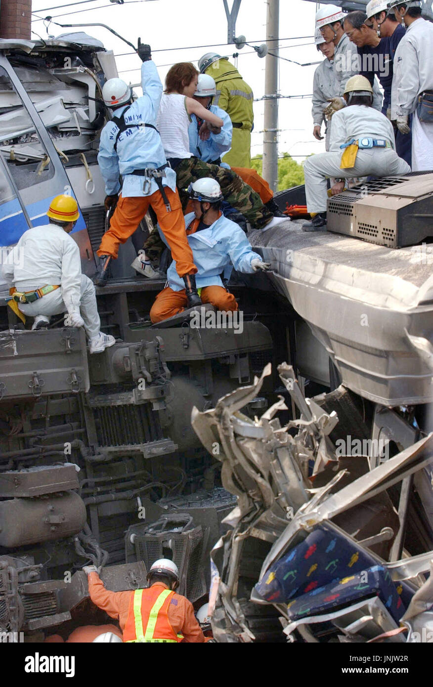 AMAGASAKI, Japan - Firefighters take part in rescue operations after a train on West Japan ...