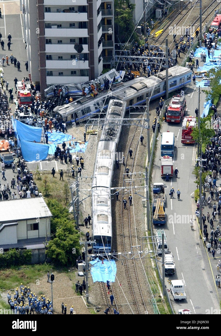 AMAGASAKI, Japan - An aerial view of a train accident on West Japan Railway Co.'s Fukuchiyama ...