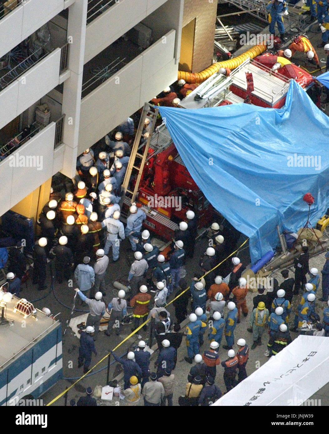 AMAGASAKI, Japan - Firefighters attempt to rescue survivors from one of two rapid commuter train ...