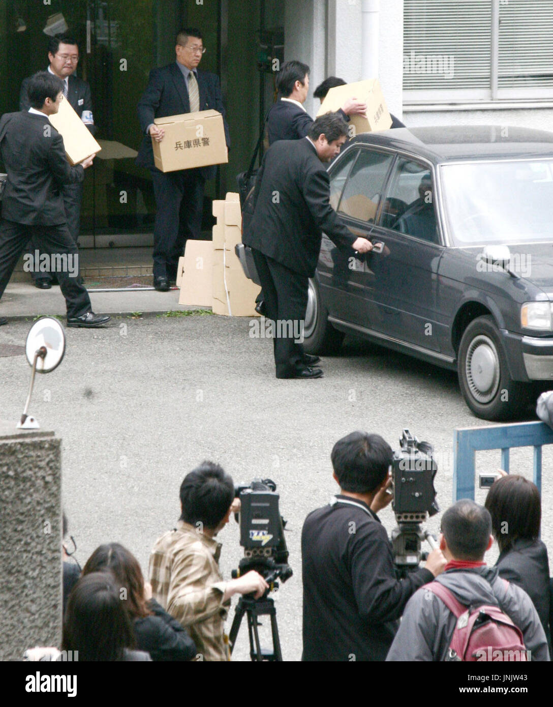 OSAKA, Japan - Police investigators put boxes of documents confiscated from West Japan Railway ...