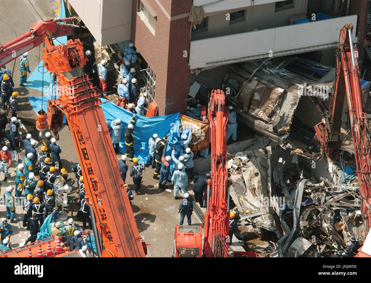 AMAGASAKI, Japan - Rescuers continue working at the site of the April 25 derailment and crash of ...