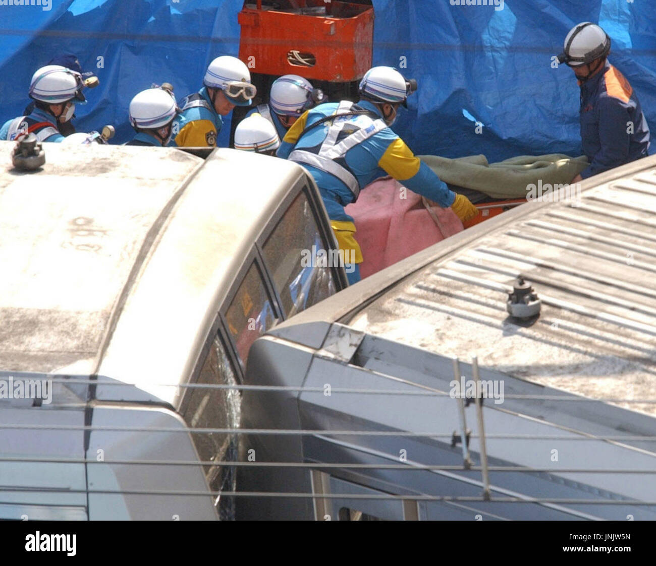 AMAGASAKI, Japan - Rescuers continue working at the site of the April 25 derailment and crash of ...