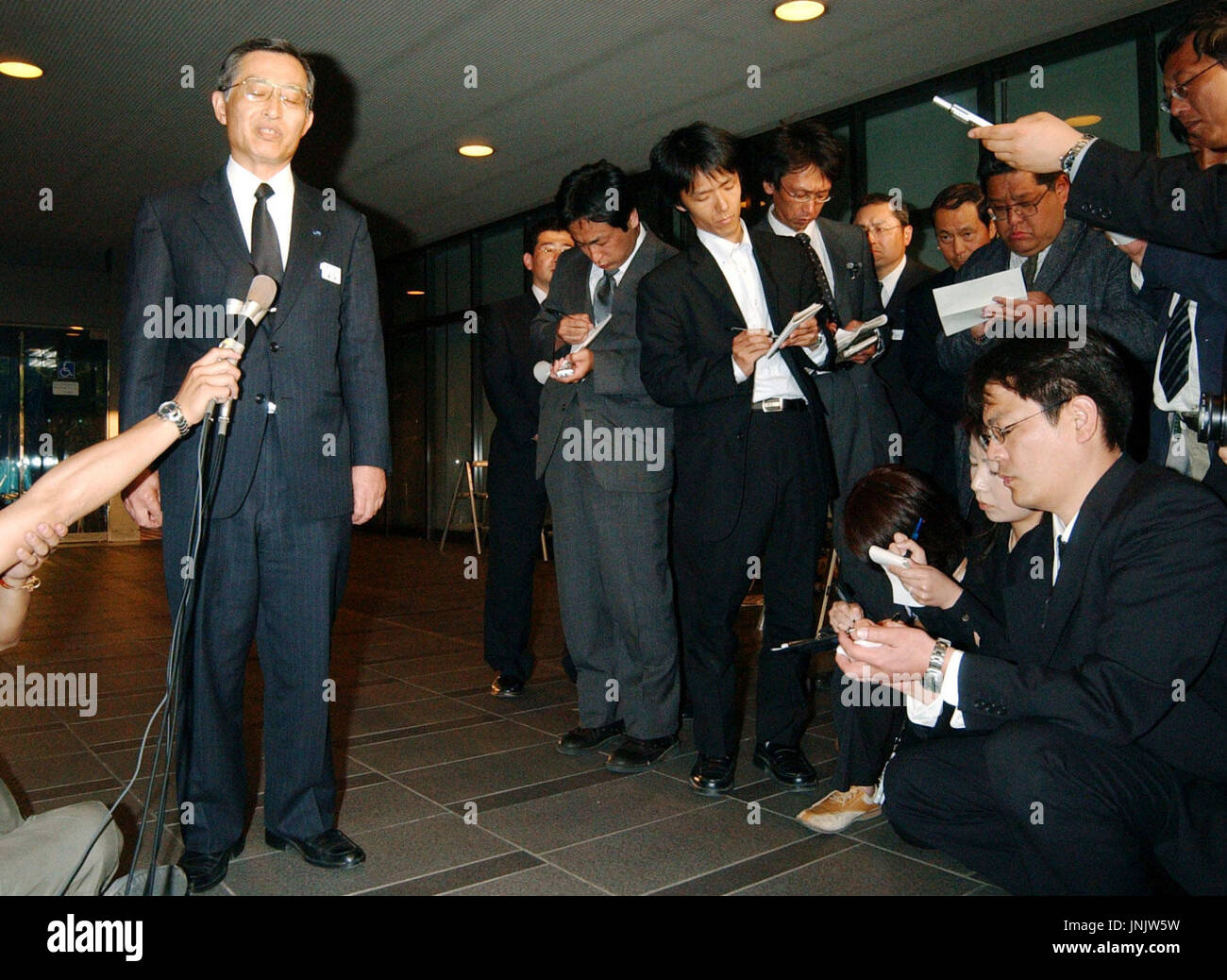 AMAGASAKI, Japan - West Japan Railway Co. President Takeshi Kakiuchi (L) responds to questions ...