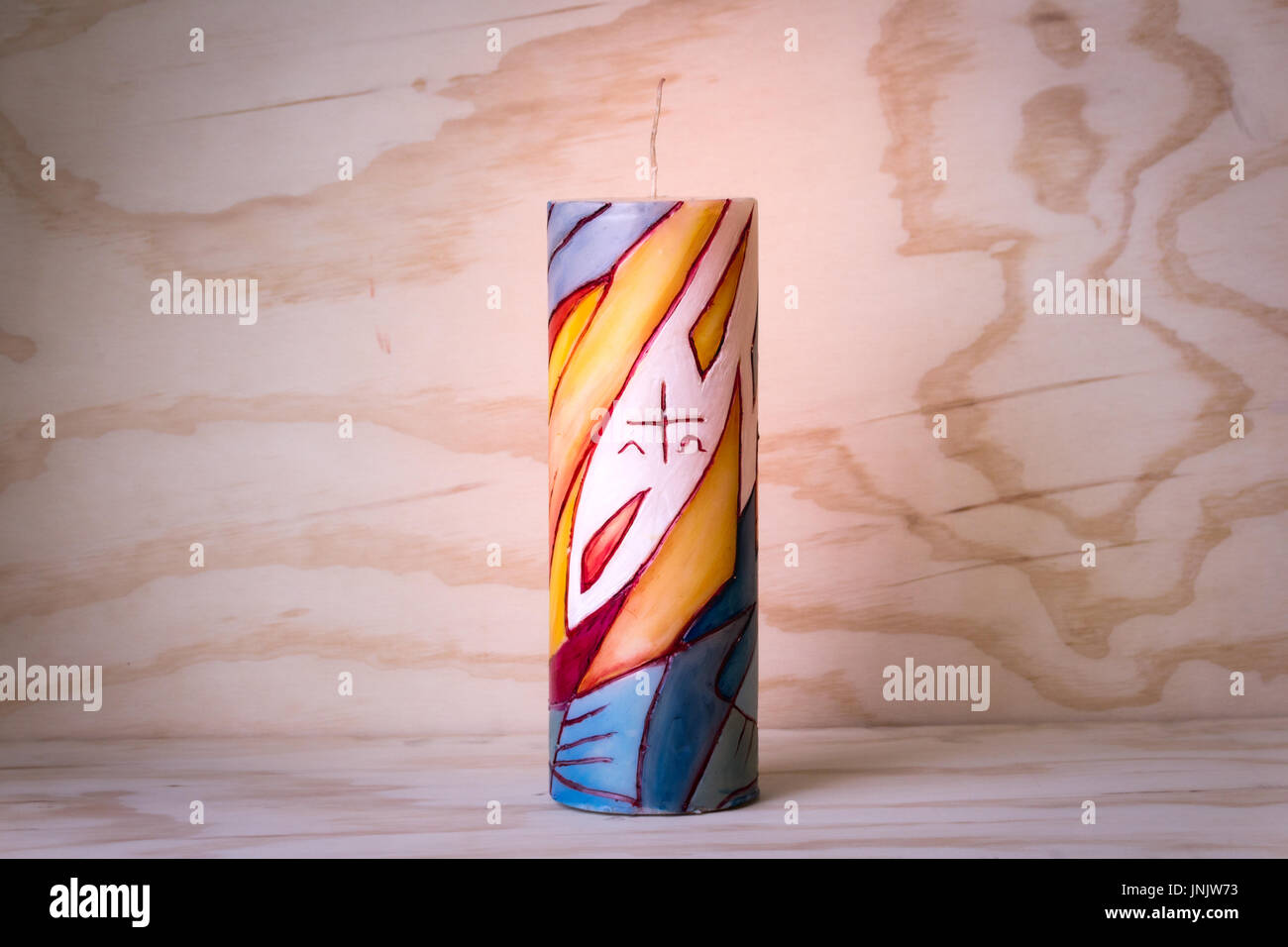 Photograph of a religious wax candle with symbols Stock Photo - Alamy