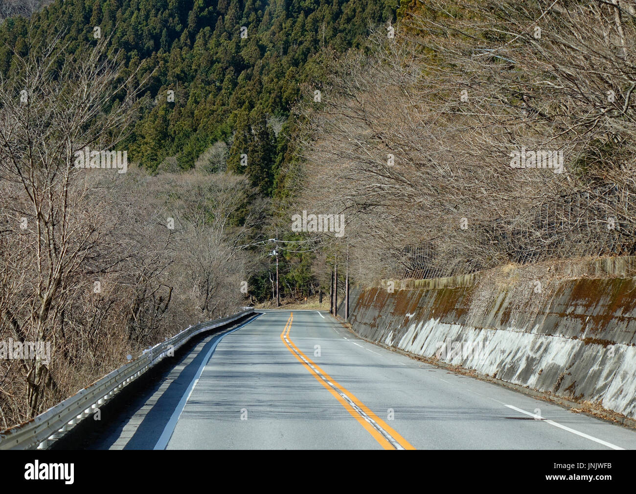Mountain road at sunny day in Nikko, Japan. Nikko is heavily dependent ...