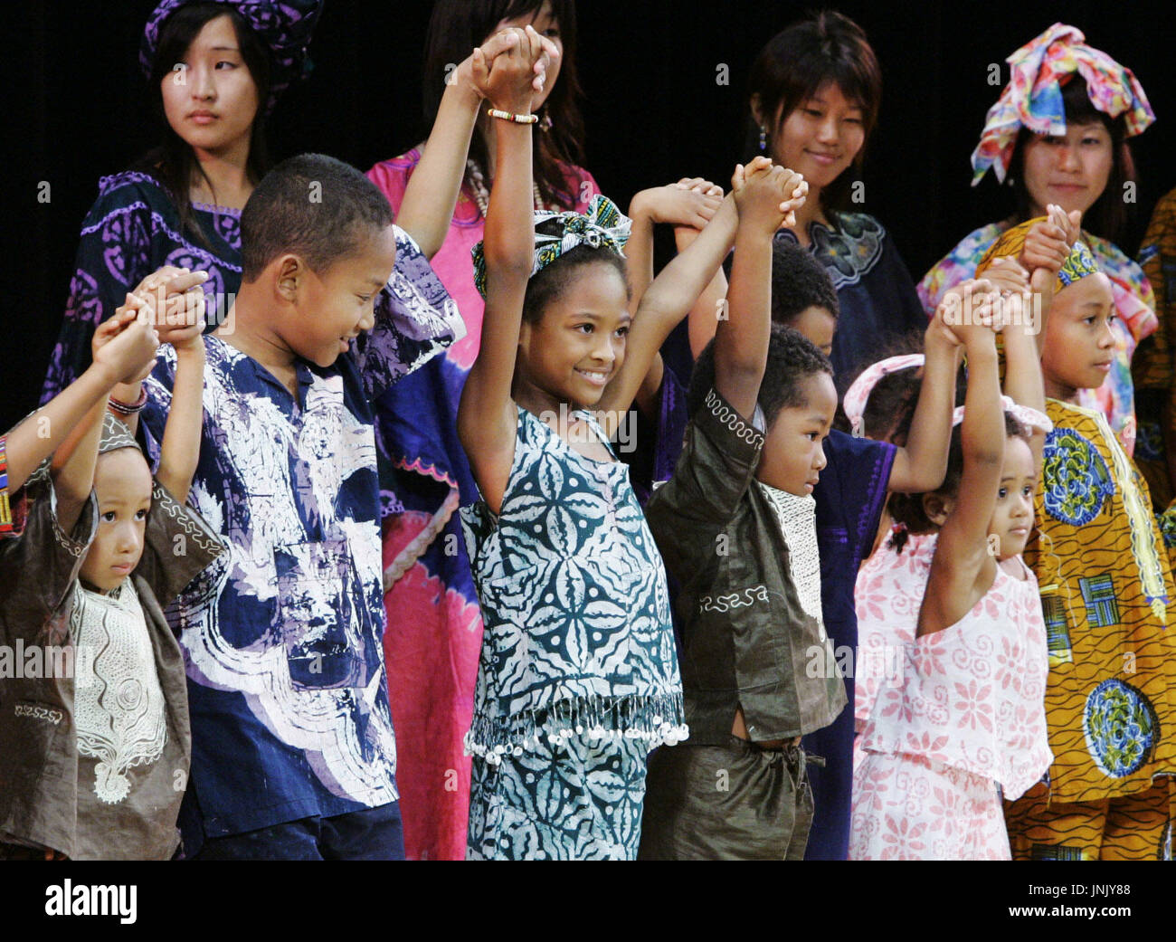 NAGAKUTE, Japan - Children wearing traditional Nigerian costume pose ...