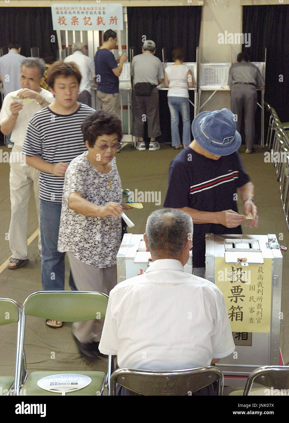 KAWASAKI, Japan - Voters casts their ballots for the House of ...