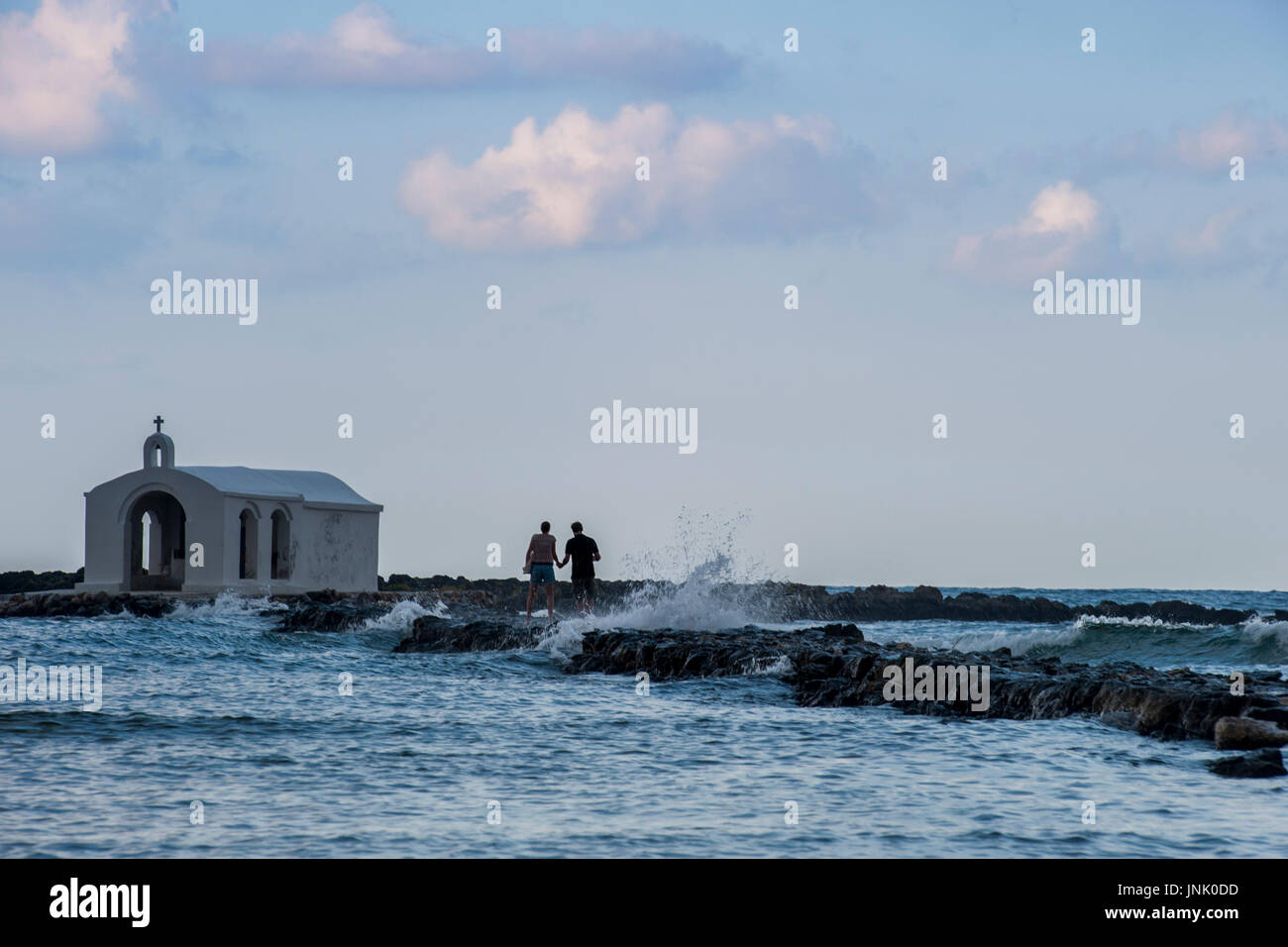 St Nicholas Chapel, a small white chapel in the sea near Georgioupolis ...