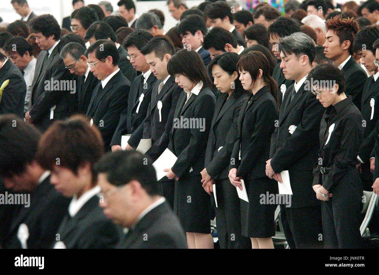 AMAGASAKI, Japan - People attending a memorial service for the 107 people who died when a ...