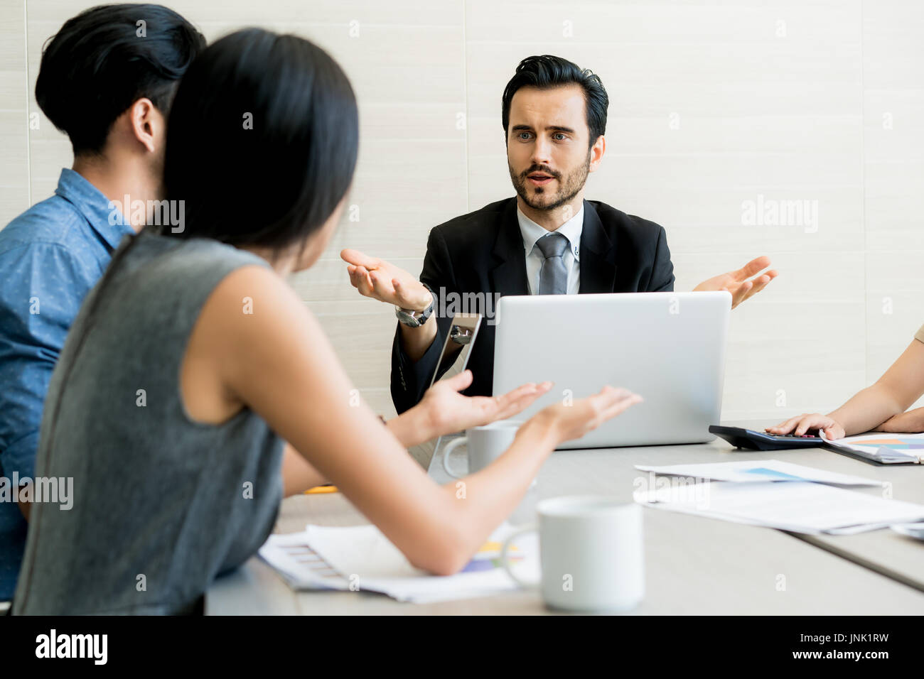 Business negotiation, male partners arguing, funny easygoing woman ...