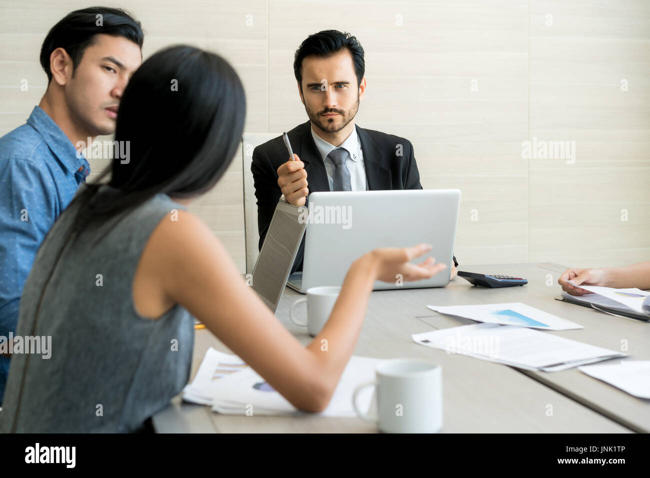 Business negotiation, male partners arguing, funny easygoing woman ...