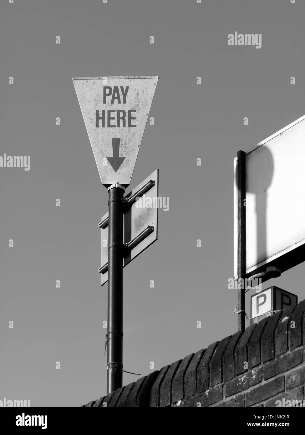 Pay here sign for pay and display public carpark Stock Photo - Alamy