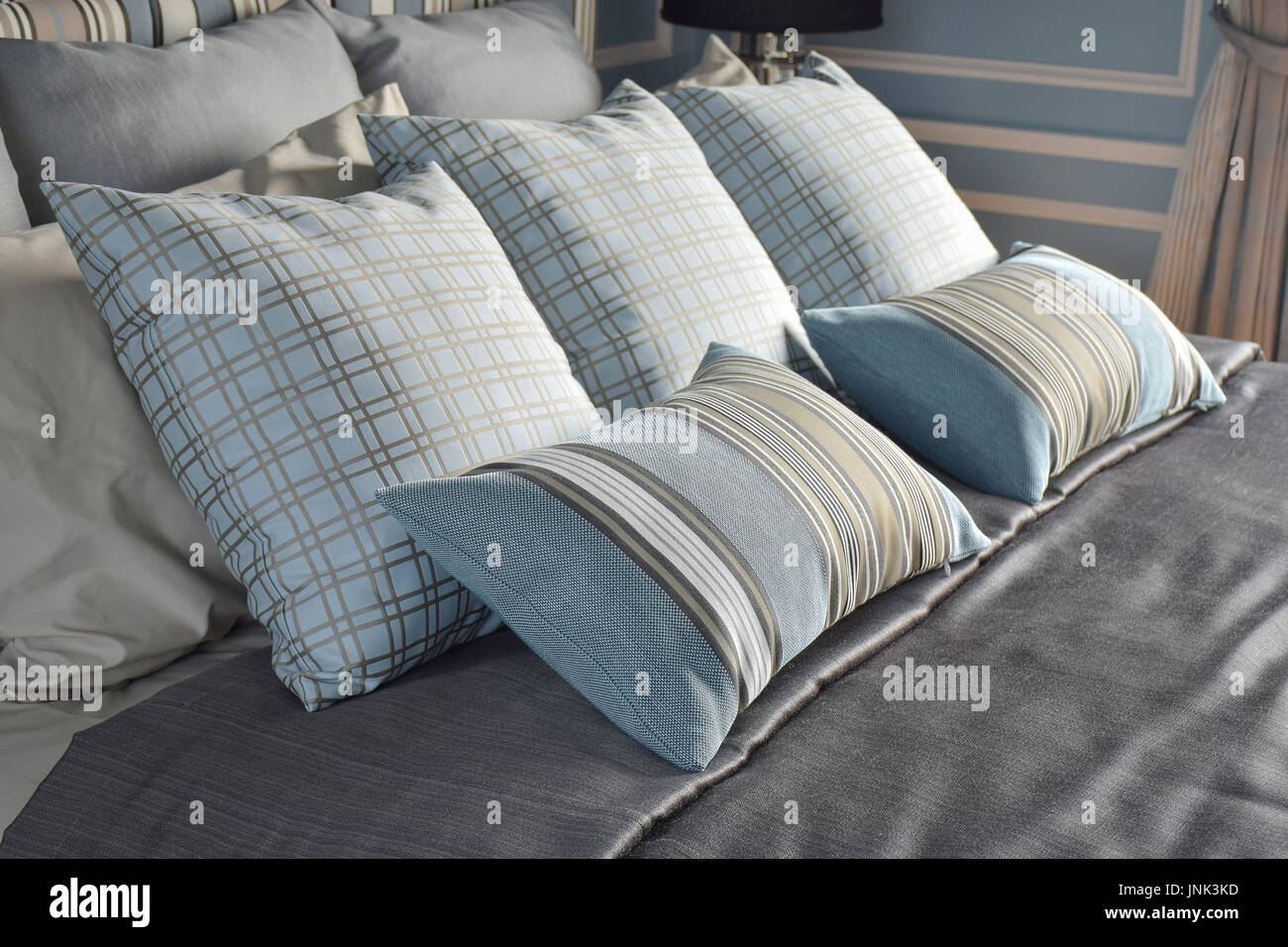 Light blue pillows in difference pattern with classic style bedding ...