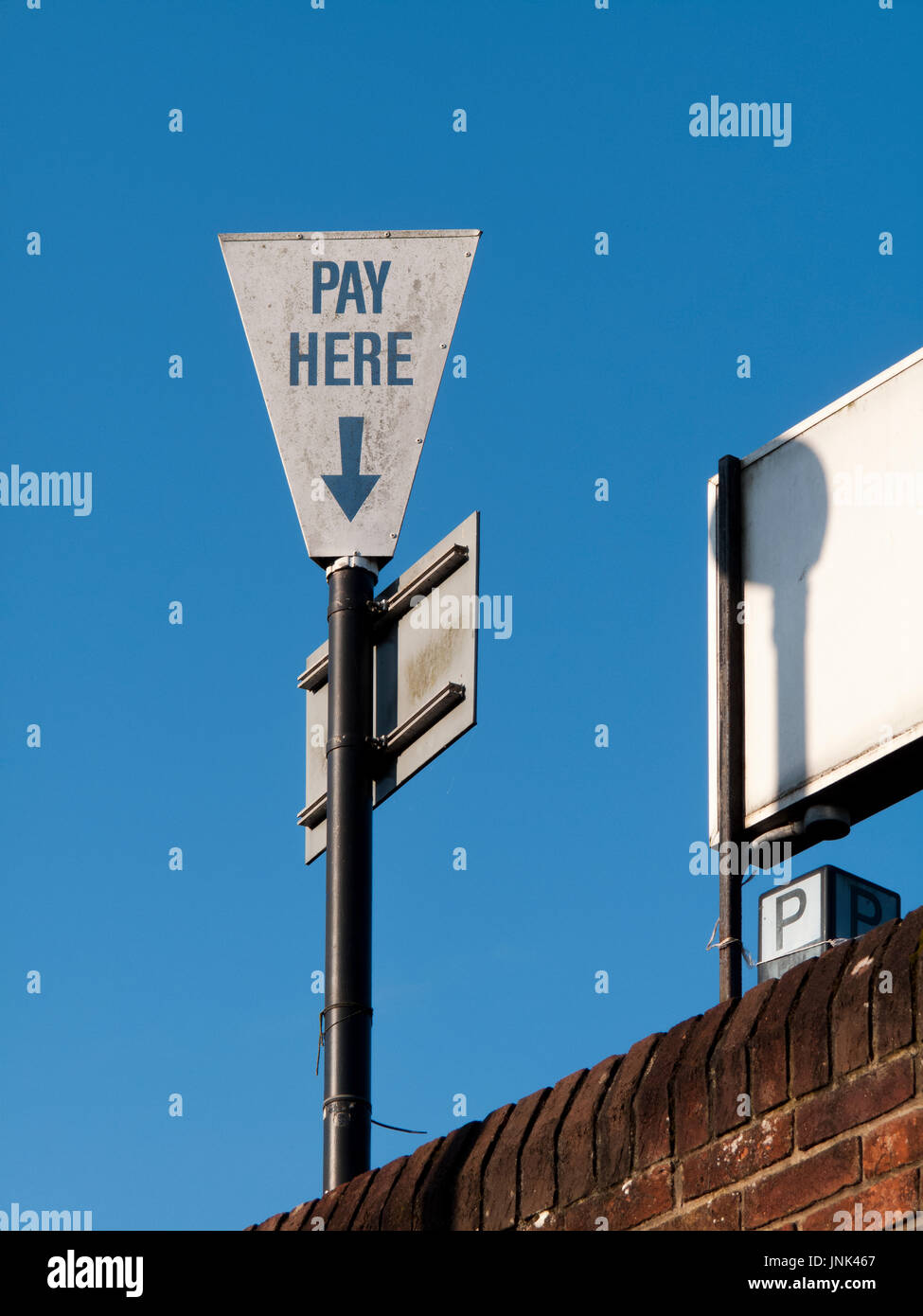 Pay here sign for pay and display public carpark Stock Photo - Alamy