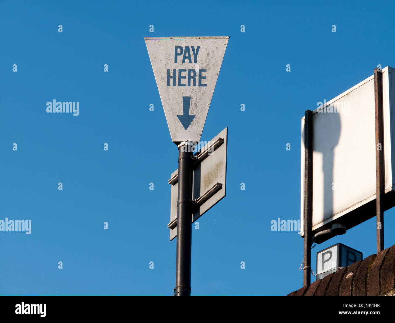 Pay here sign for pay and display public carpark Stock Photo - Alamy