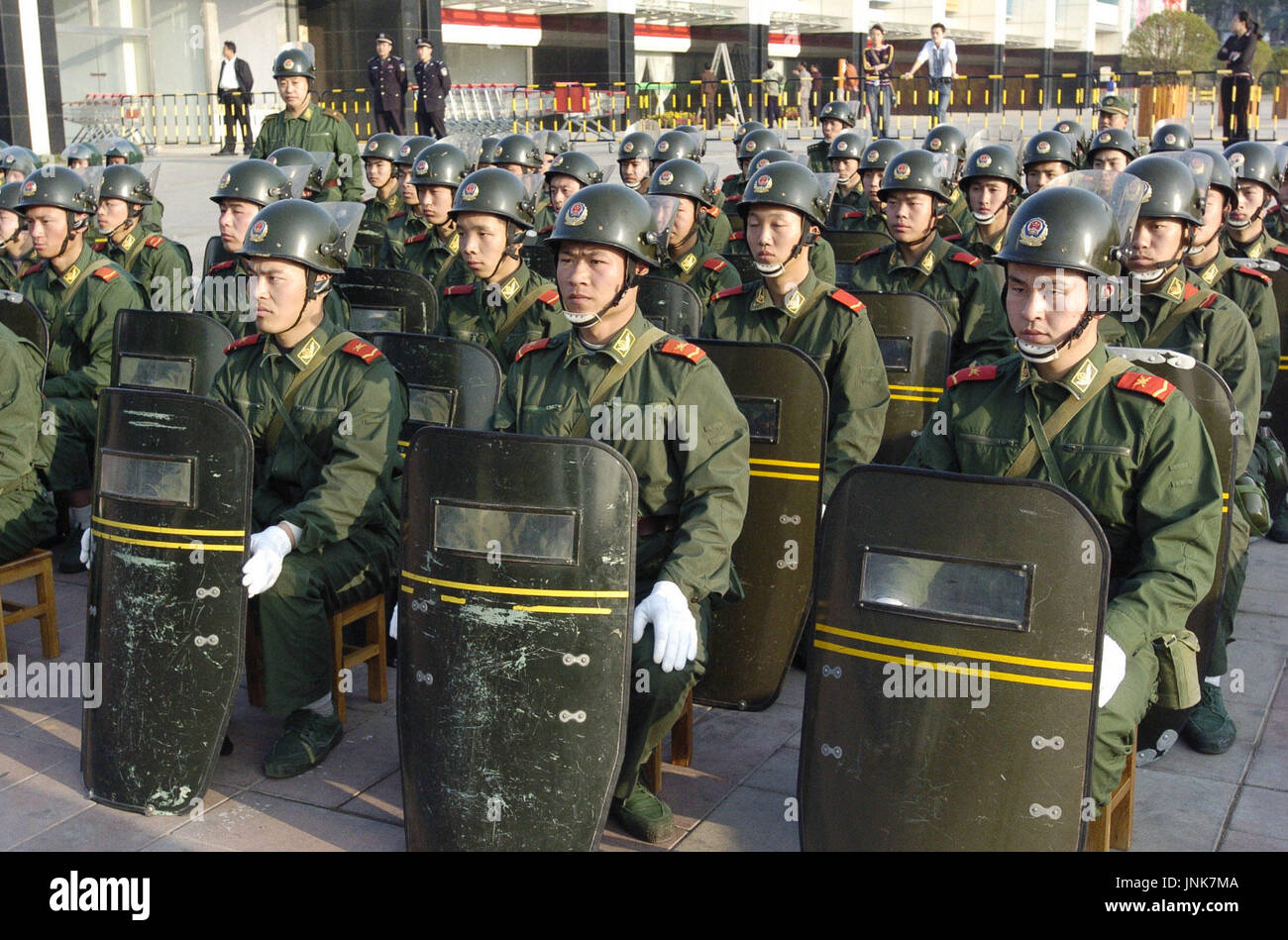 JINAN, China - Uniformed police officers stand on guard outside a ...