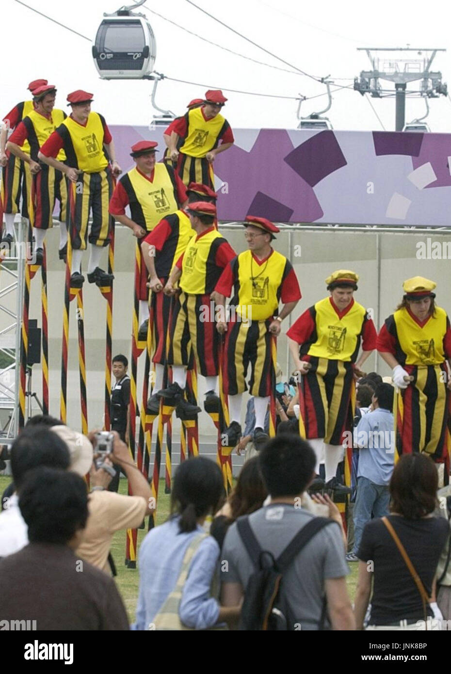 NAGAKUTE, Japan - Performers march on stilts in the Belgium national ...